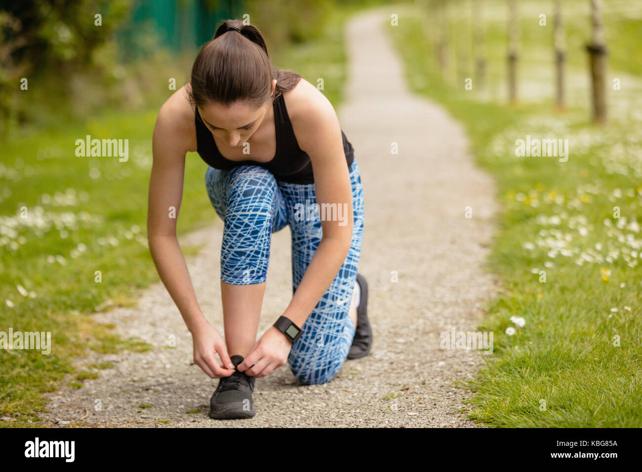 Woman tying laces sneakers hi-res stock photography and images - Alamy