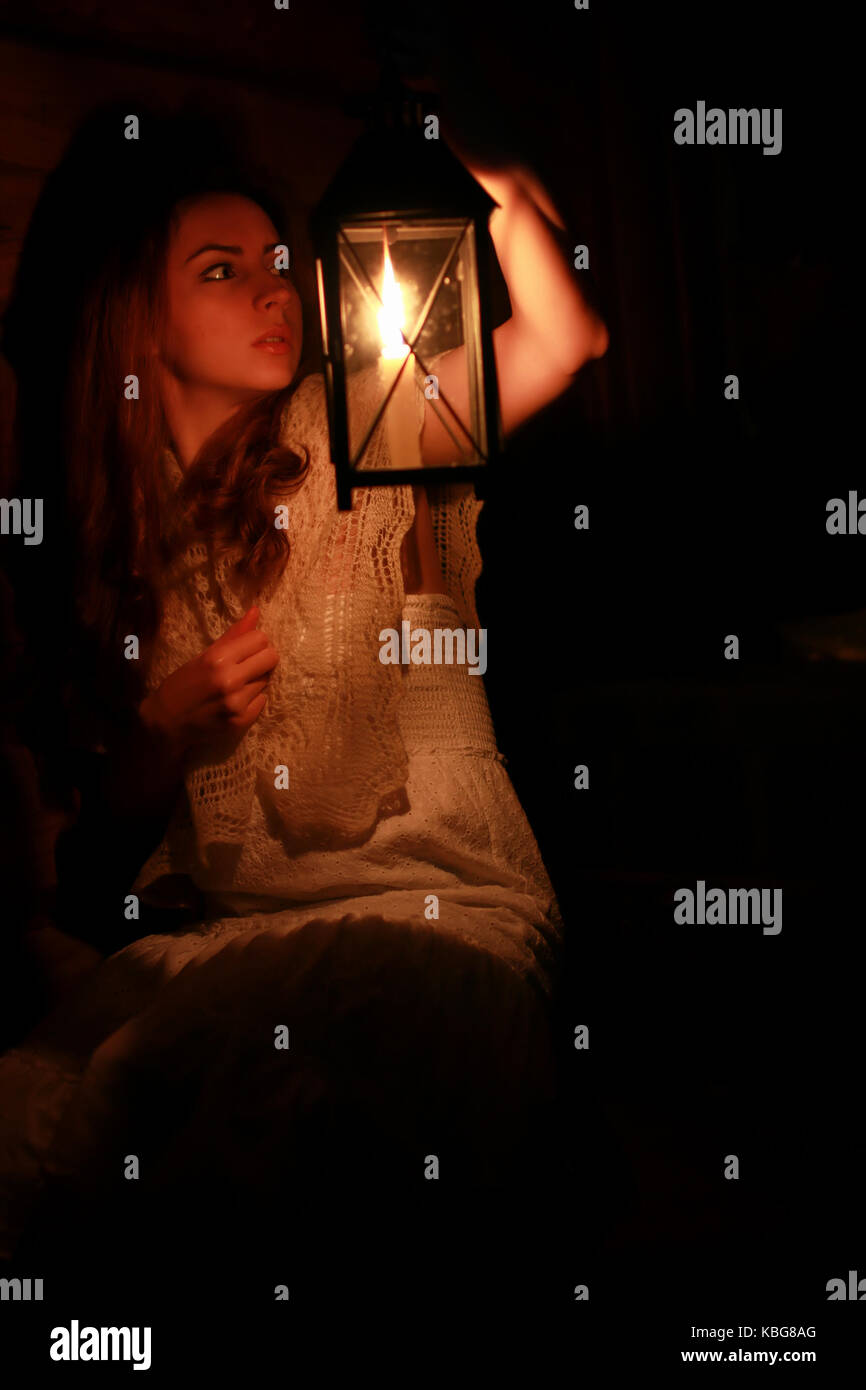 woman candle lamp dark night Stock Photo - Alamy