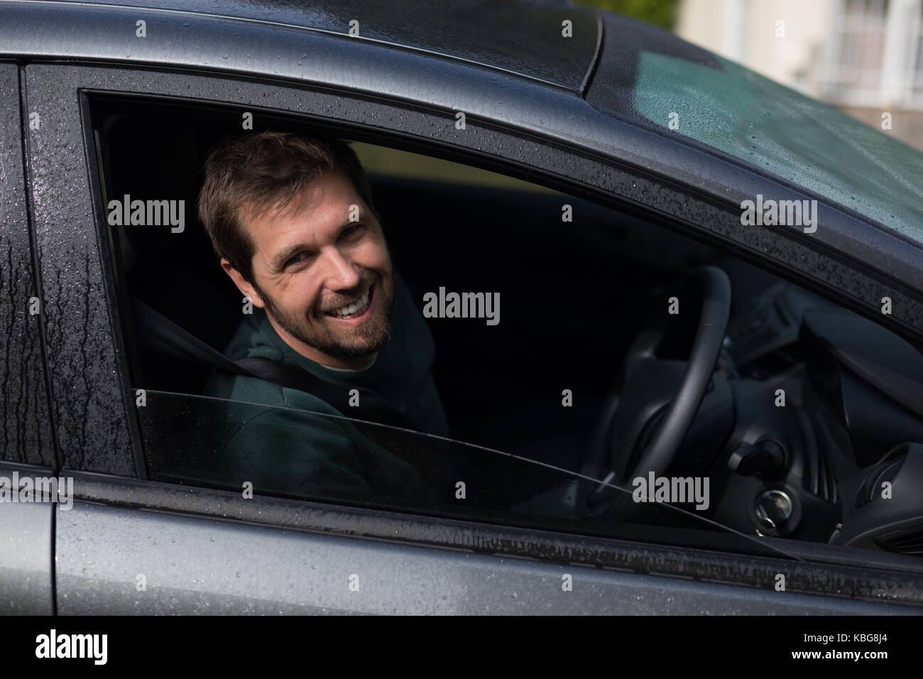 Portrait of man driving a car Stock Photo - Alamy