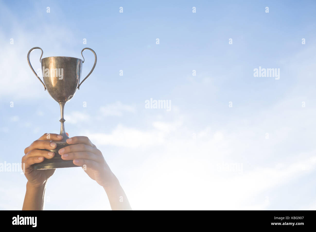 Hand holding trophy hi-res stock photography and images - Alamy