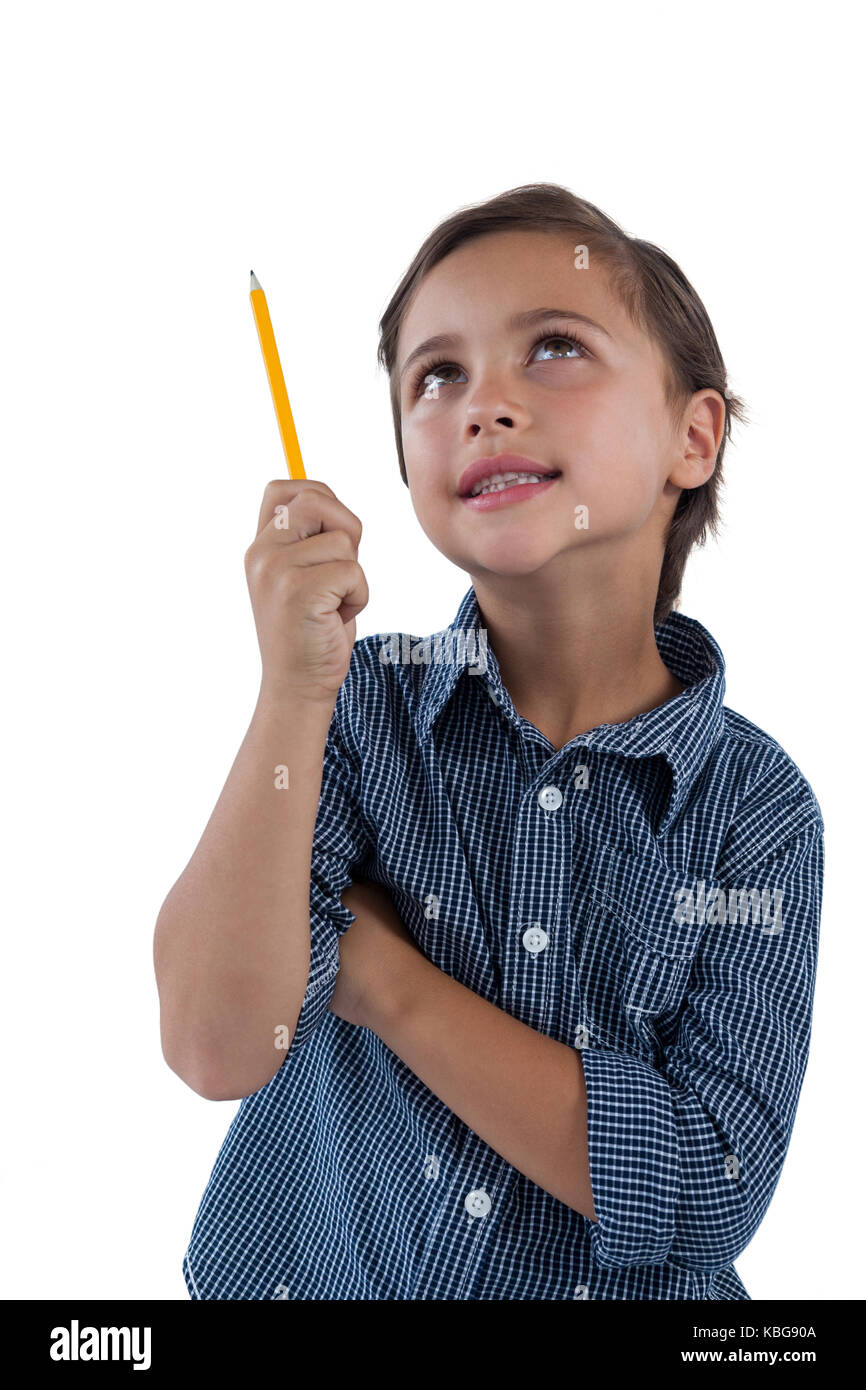 Thoughtful boy standing against white background Stock Photo - Alamy