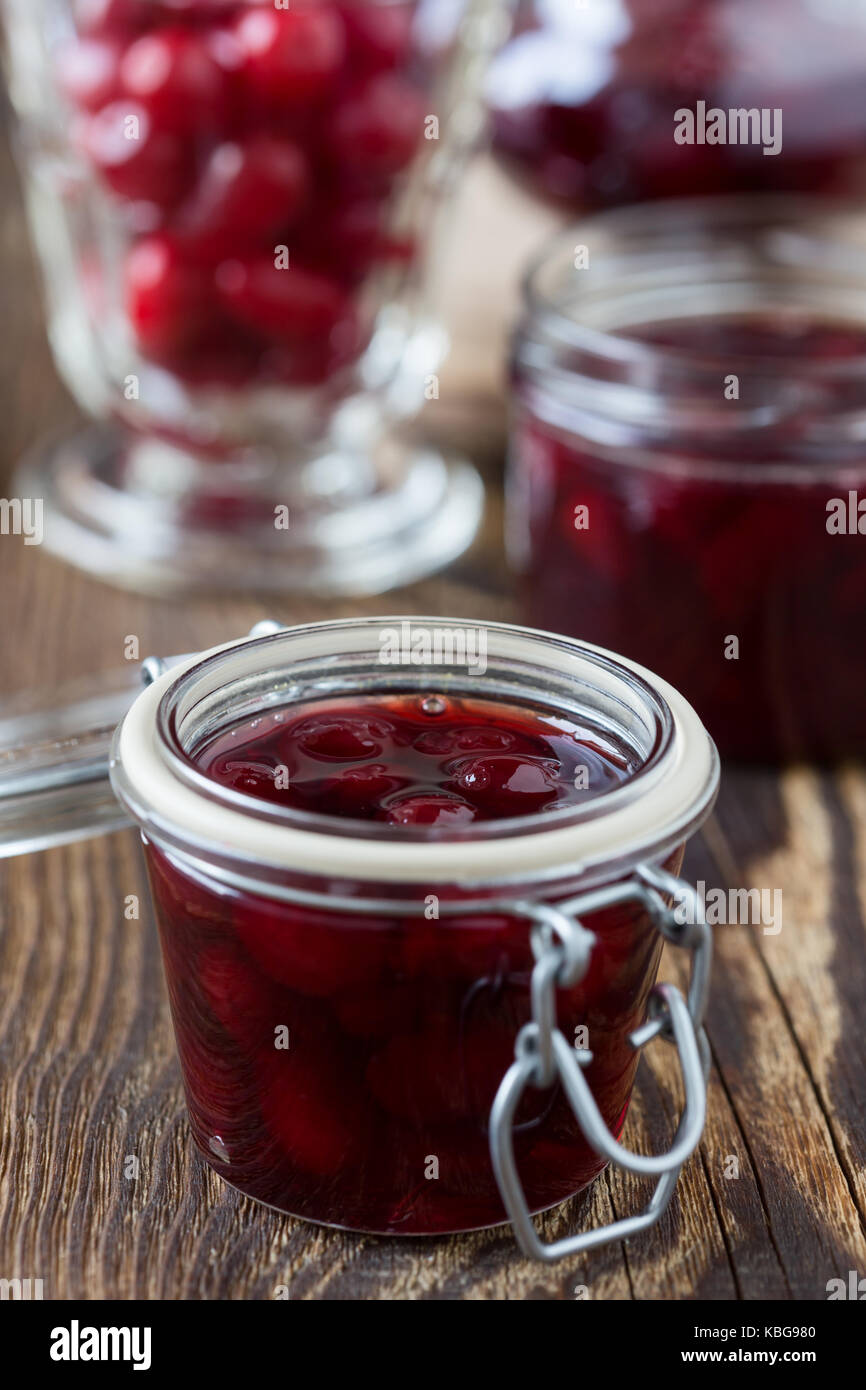 Dogwood jam and ripe cornel berries on rural wooden background Stock ...