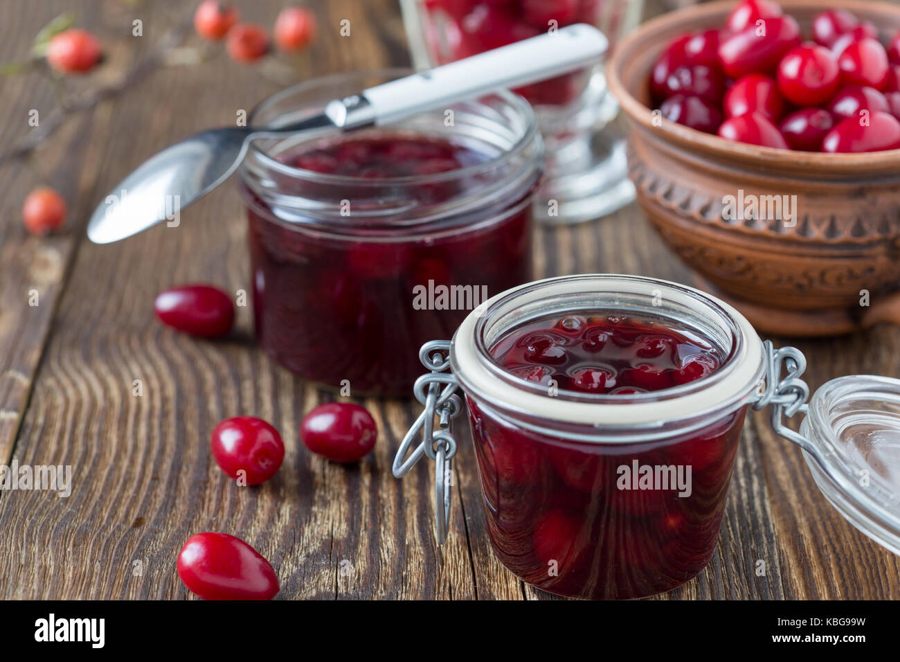 Dogwood jam and ripe cornel berries on rural wooden background Stock ...