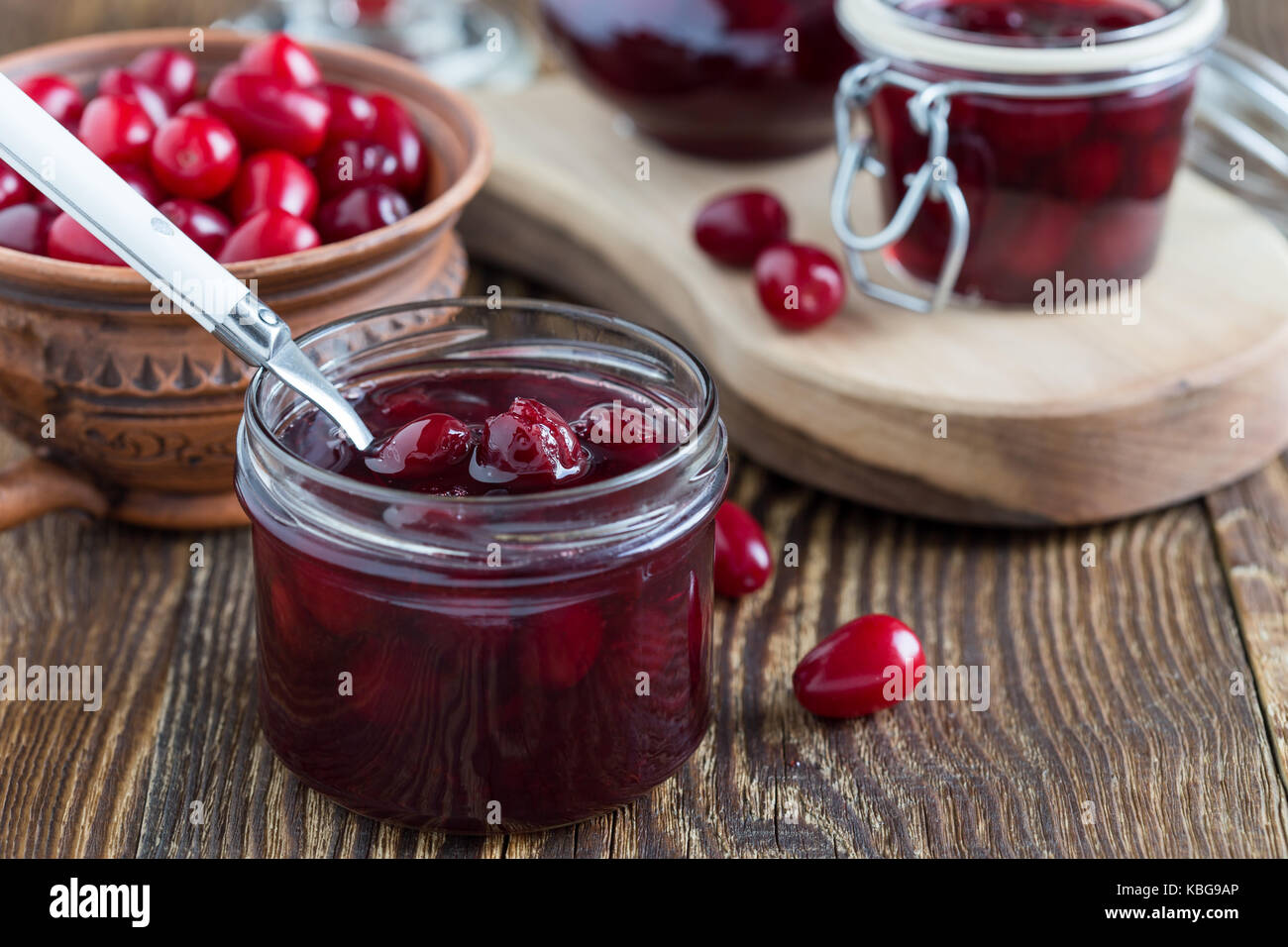 Dogwood jam and ripe cornel berries on rural wooden background Stock ...