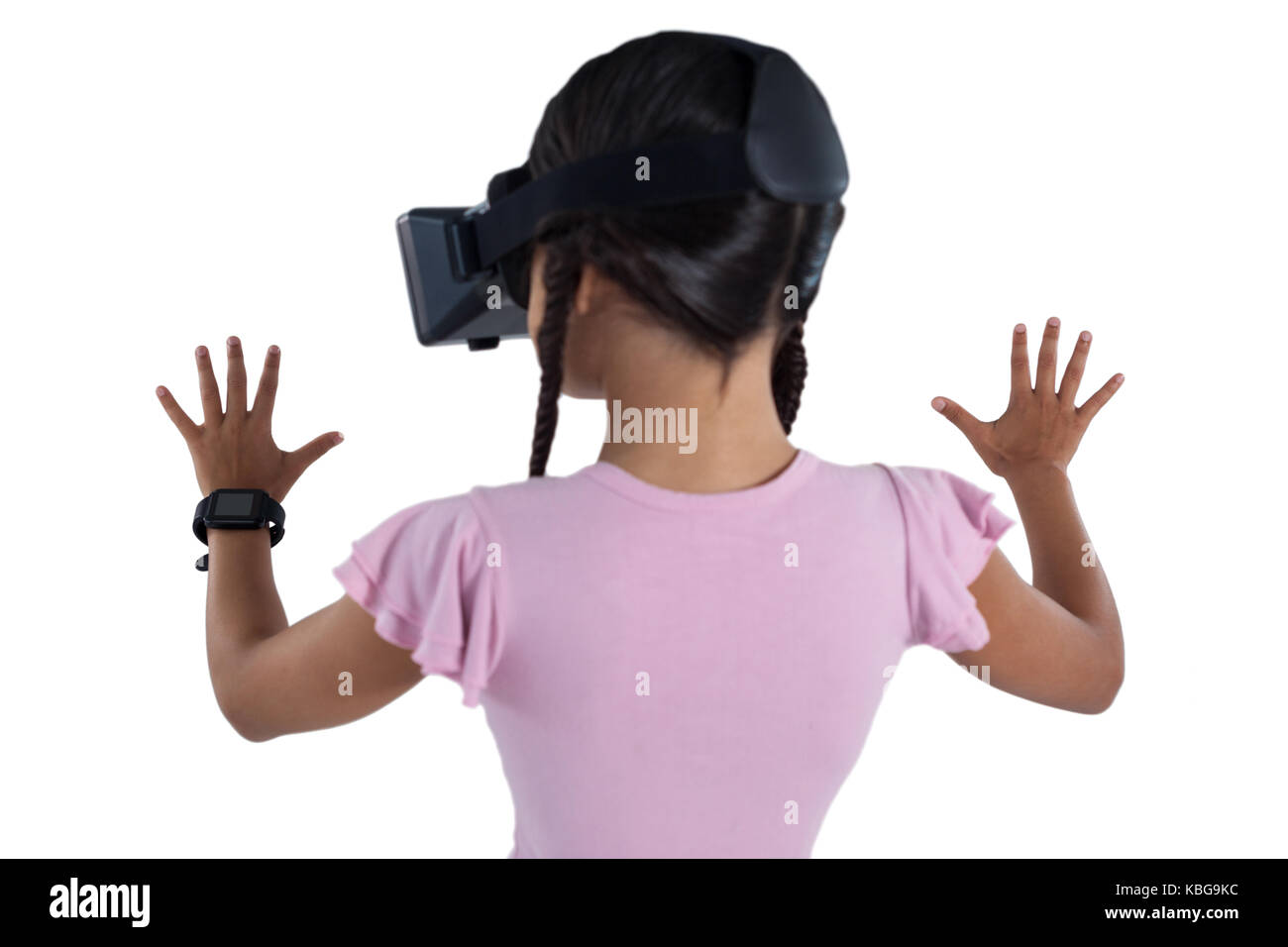 Rear view of girl using virtual reality headset against white ...