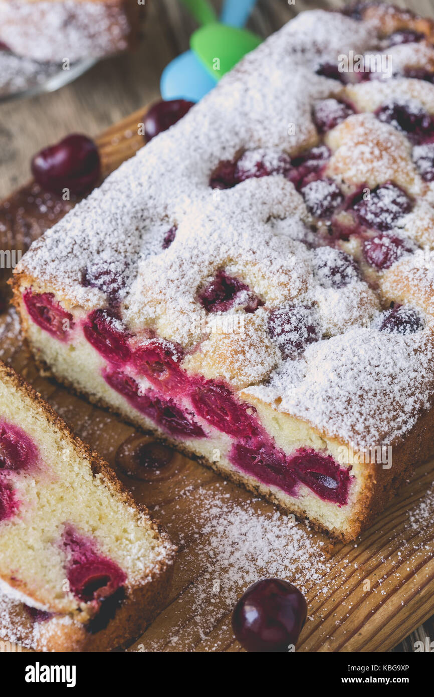 Homemade cherry cake on rustic wooden table Stock Photo - Alamy