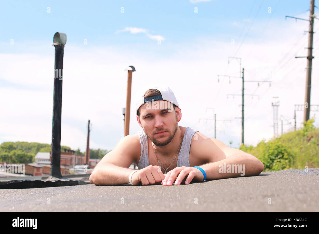 A man dressed in hip hop style poses Stock Photo - Alamy