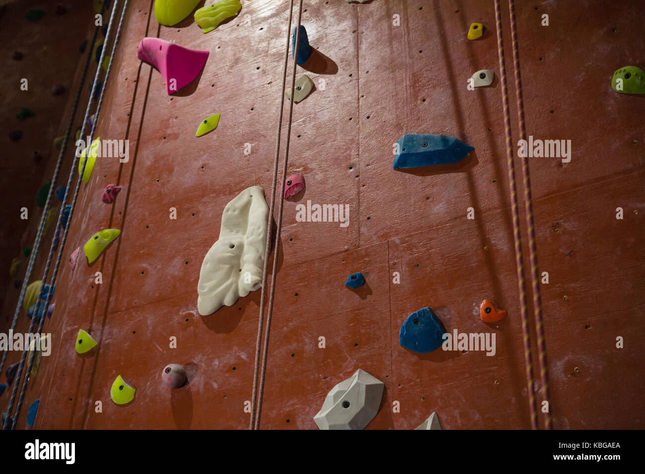 Low angle view of rope hanging by climbing wall at health club Stock ...