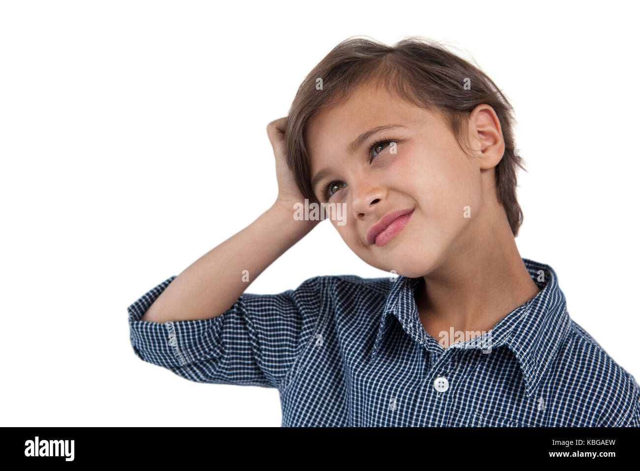 Thoughtful boy standing against white background Stock Photo - Alamy