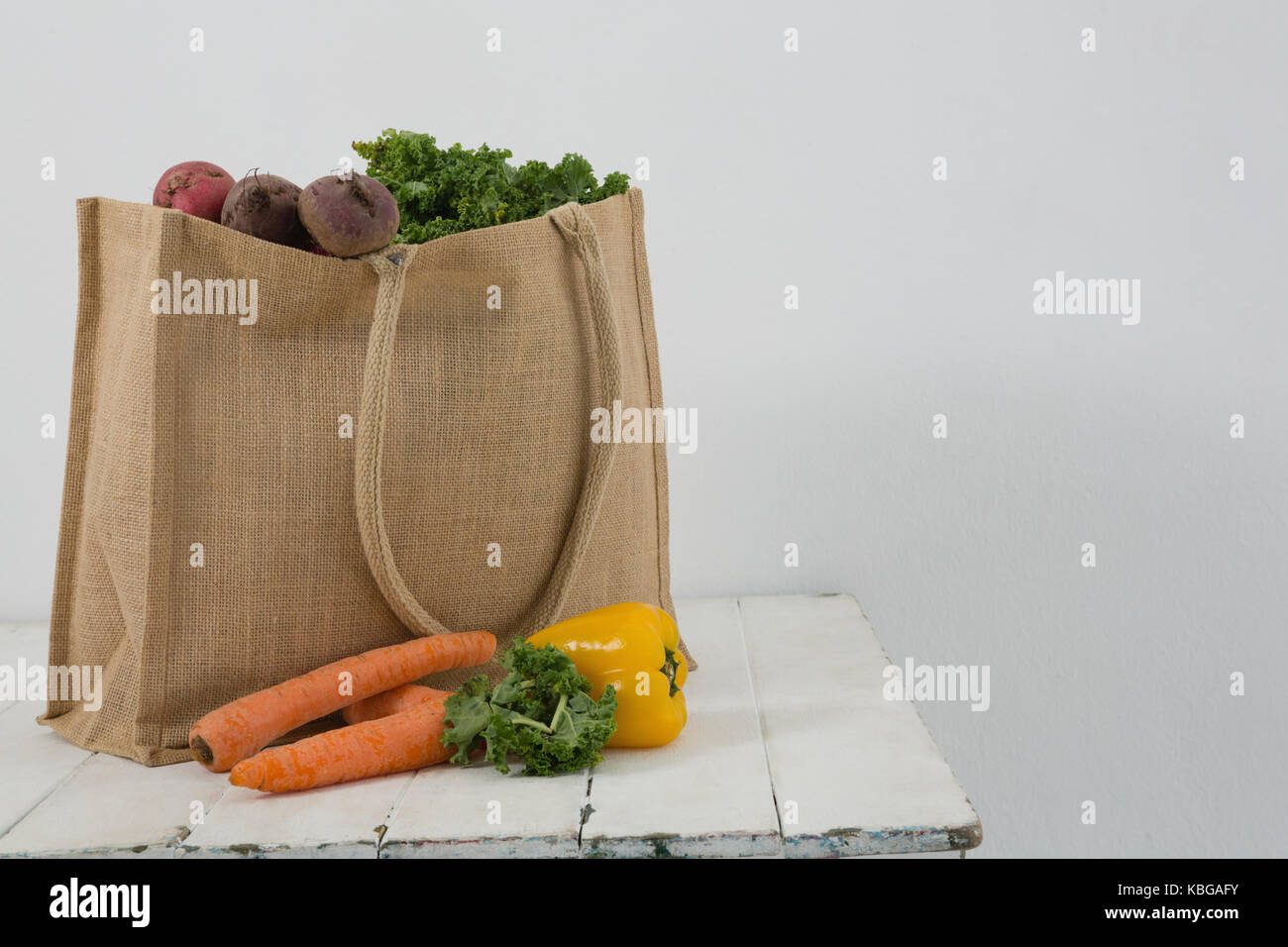 Fresh vegetables in grocery bag on table Stock Photo - Alamy