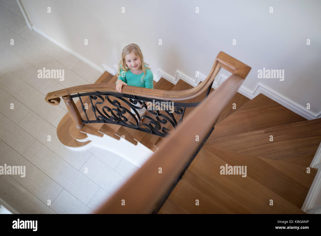 Portrait of young girl standing on the stairs Stock Photo - Alamy