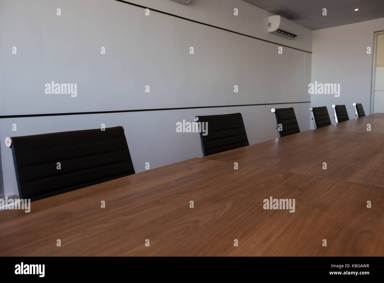 Empty office chairs at conference table in modern meeting room Stock ...