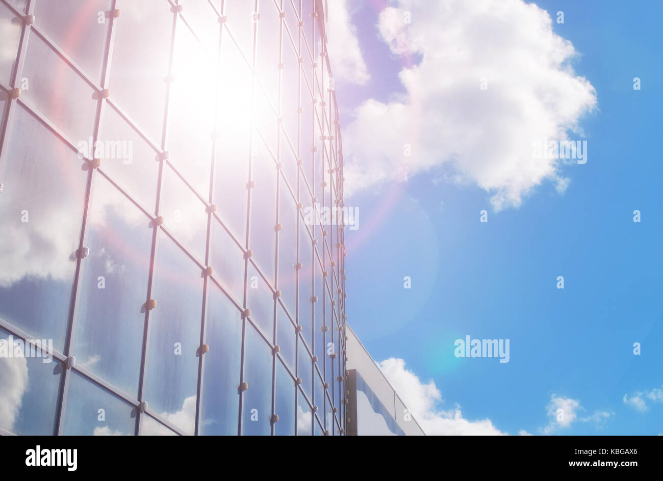 the sun and the sky in a glass building Stock Photo - Alamy