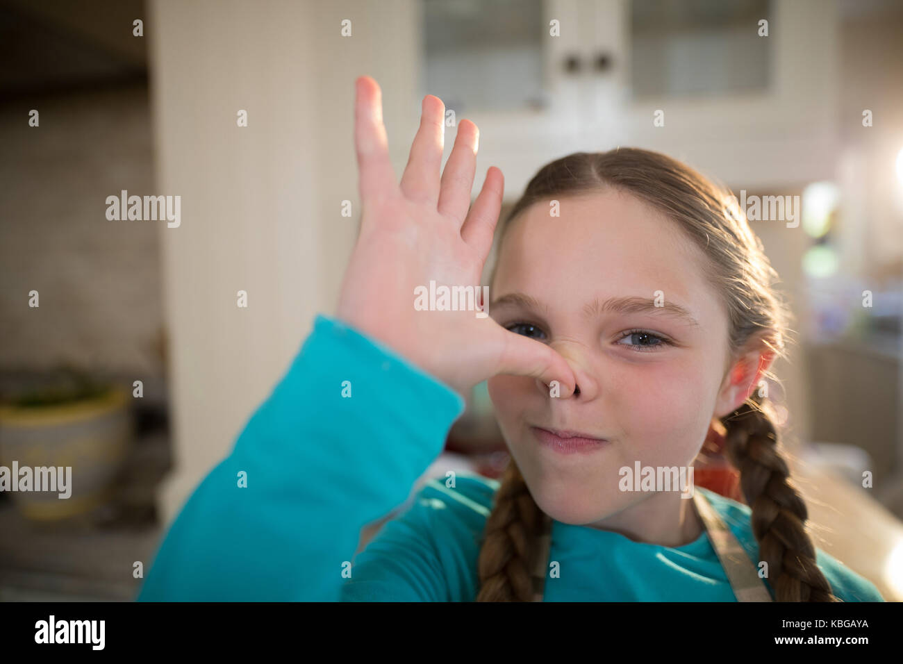 Portrait of young girl making funny faces at home Stock Photo - Alamy