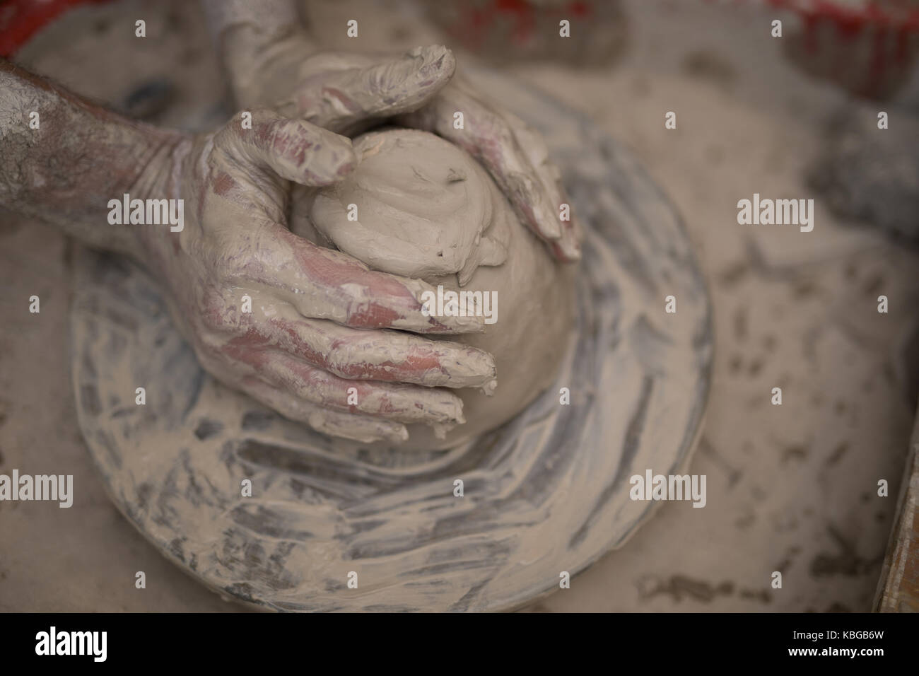 Close-up of male potter molding a clay in pottery workshop Stock Photo ...