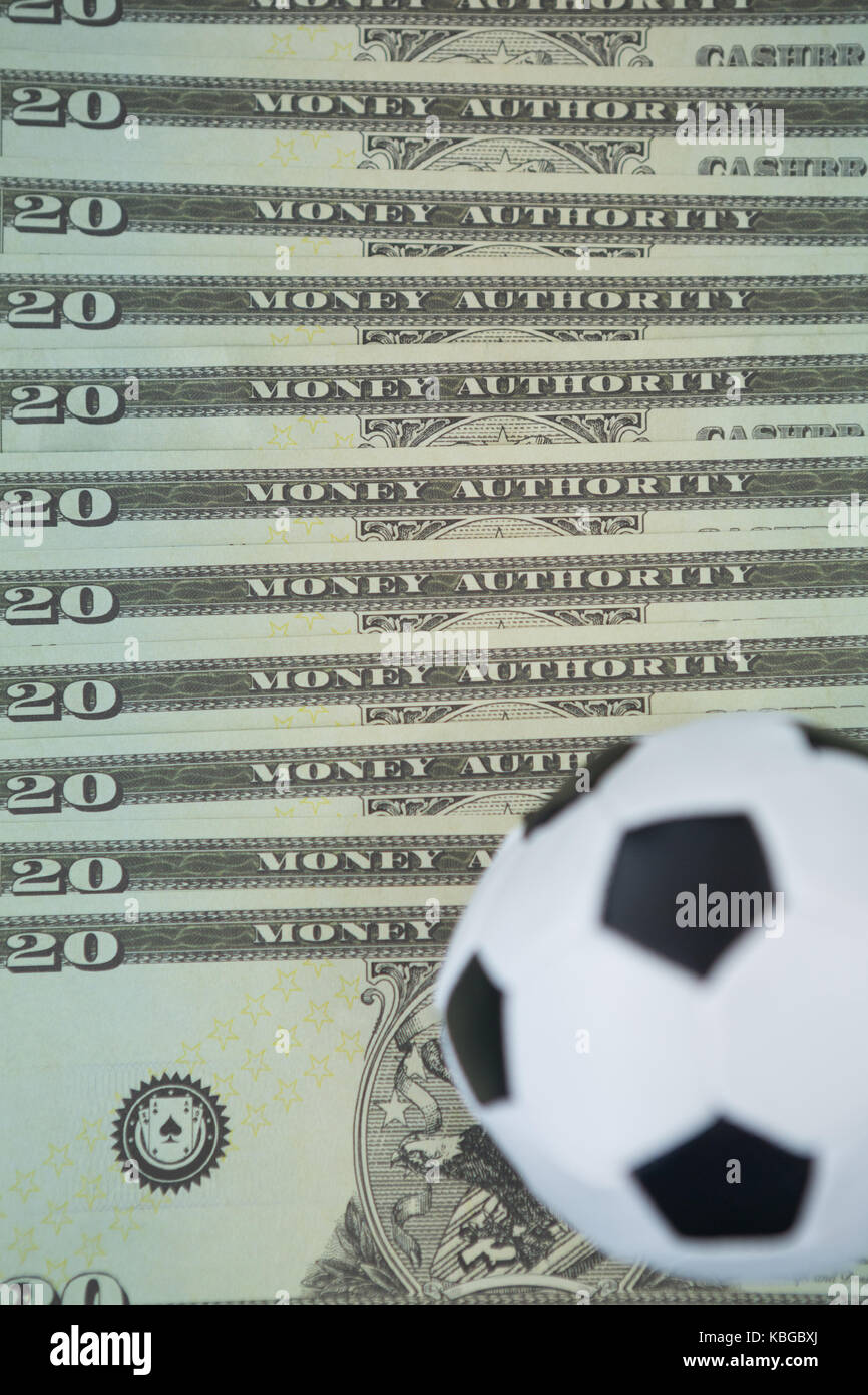 Close-up of footballs on a currency notes Stock Photo - Alamy