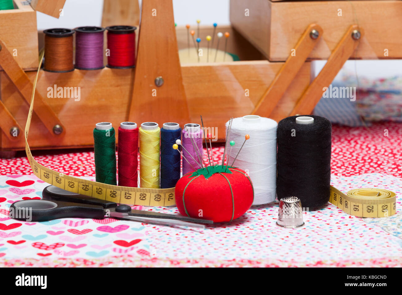Sewing kit on pieces of cloth Stock Photo - Alamy