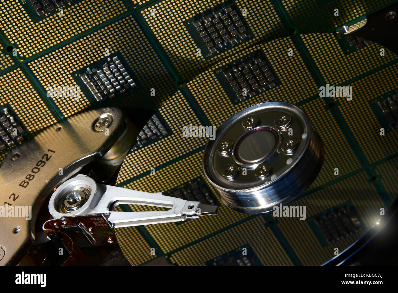 Hard disk drive opened with reflection of processors on the surface of ...