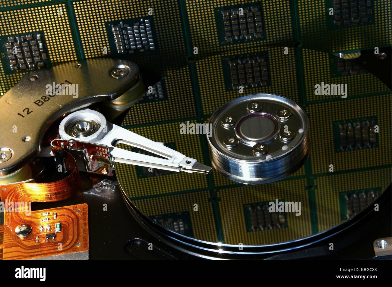 Hard disk drive opened with reflection of processors on the surface of ...