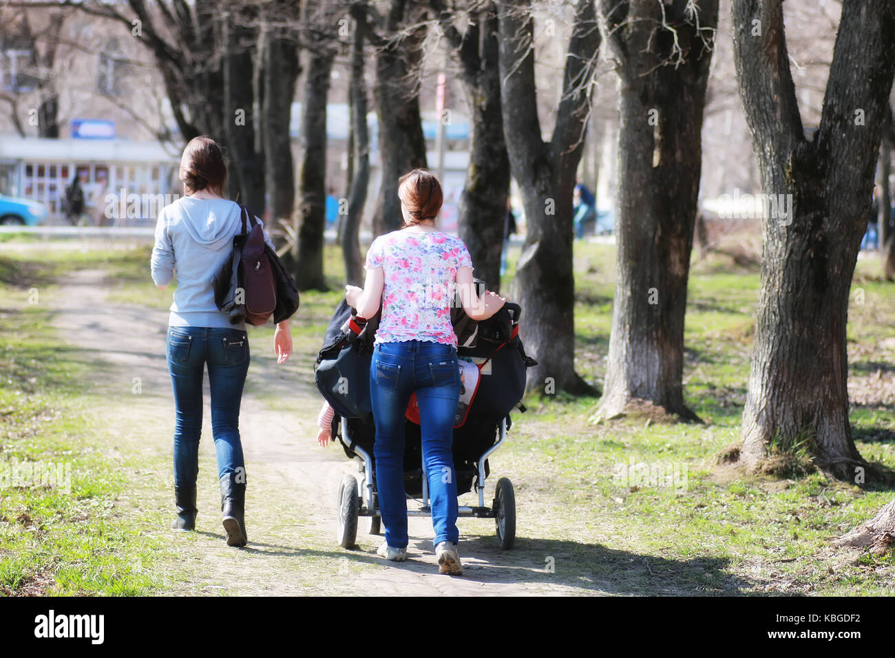 young mother with stroller in park Stock Photo - Alamy