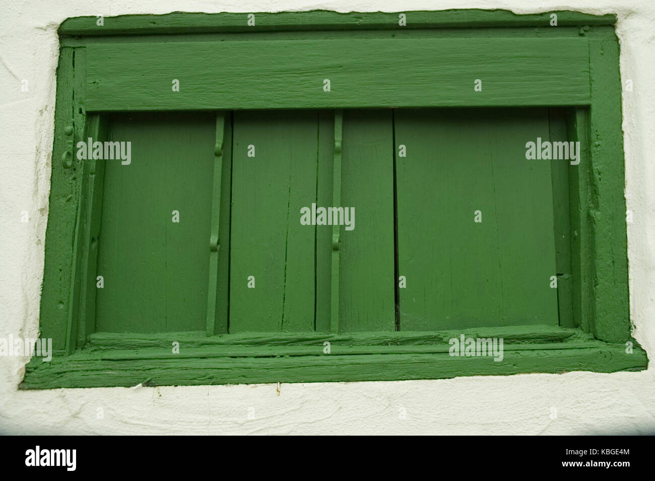 green painted window at old house Stock Photo - Alamy
