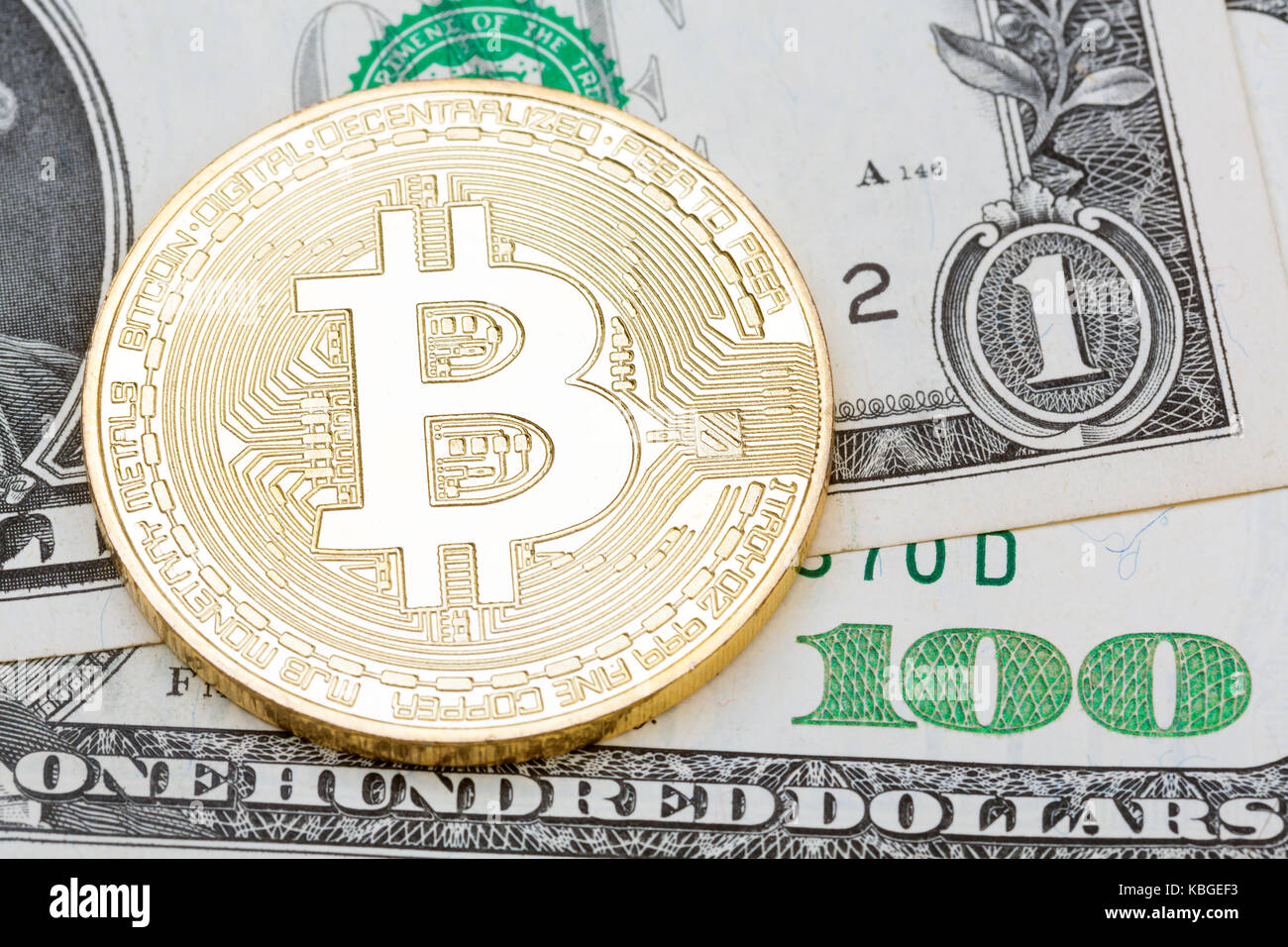 Golden cruptocurrency on different dollars background Stock Photo - Alamy