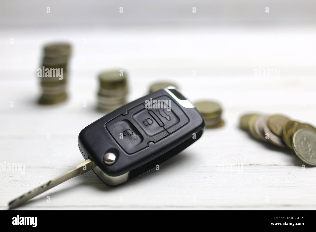 car key and coin on background Stock Photo - Alamy
