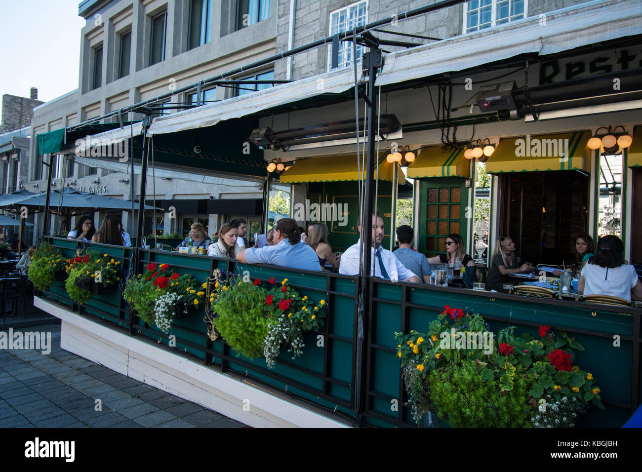 restaurant in Montreal Canada with hanging baskets autumn food people ...