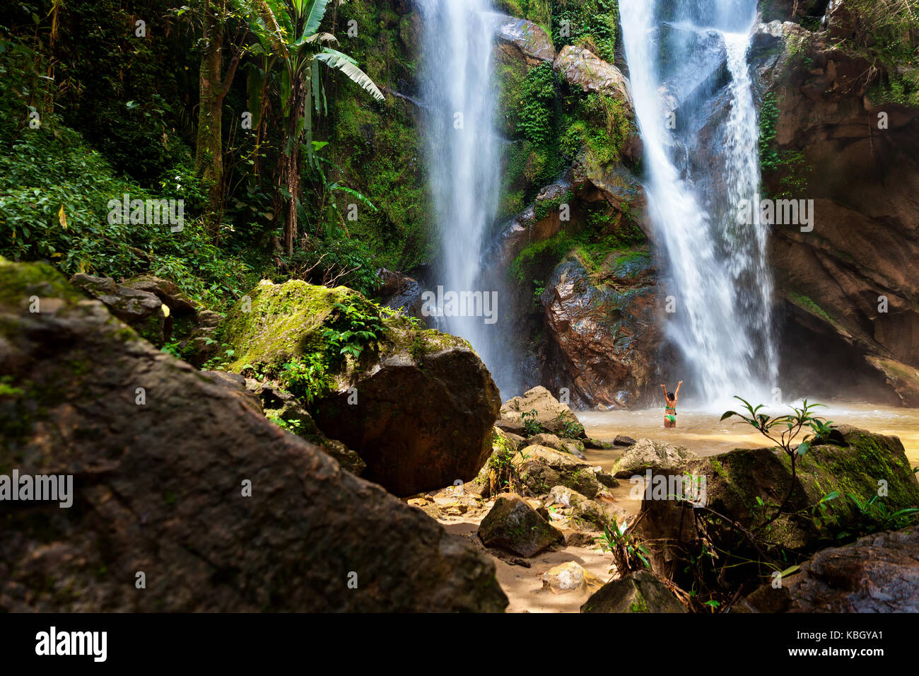 Waterfall hidden in the tropical jungle Stock Photo - Alamy