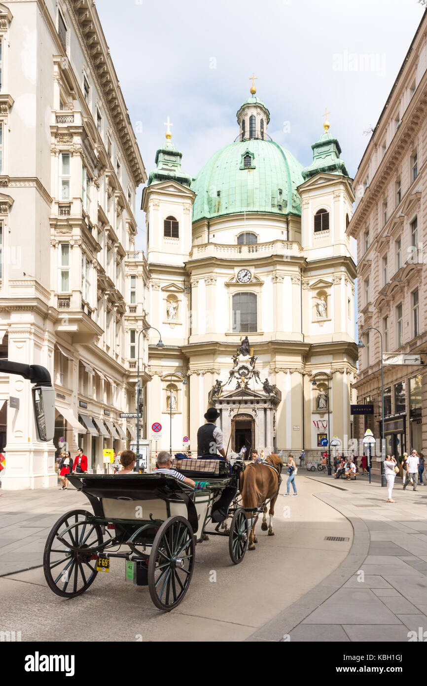 VIENNA, AUSTRIA - AUGUST 28: Tourists in a horse-drawn carriage called ...