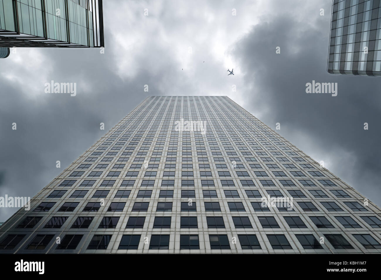 plane flying over a skyscraper in London Stock Photo - Alamy