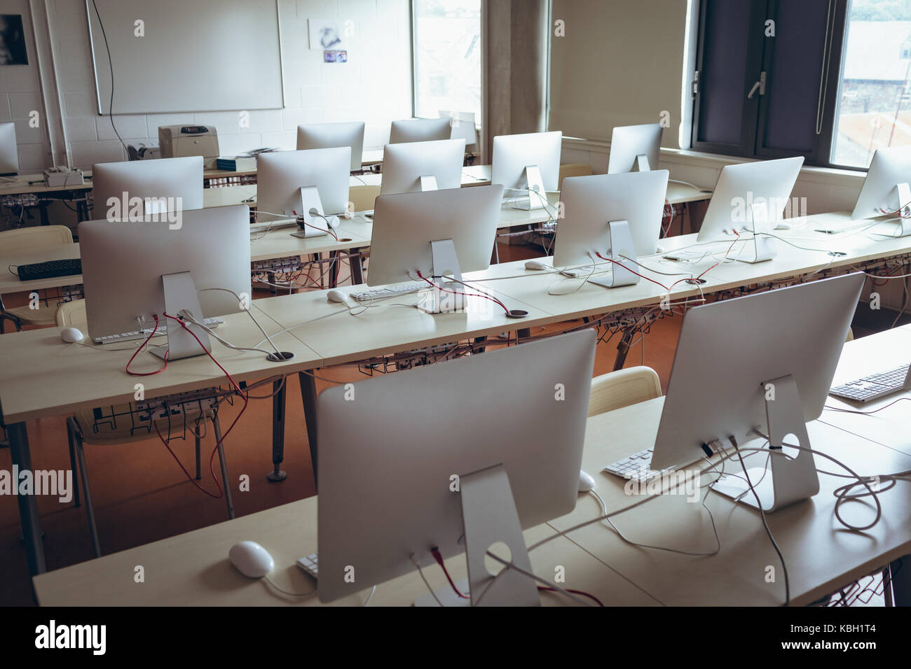 Desktop pc arranged on desk in office Stock Photo - Alamy
