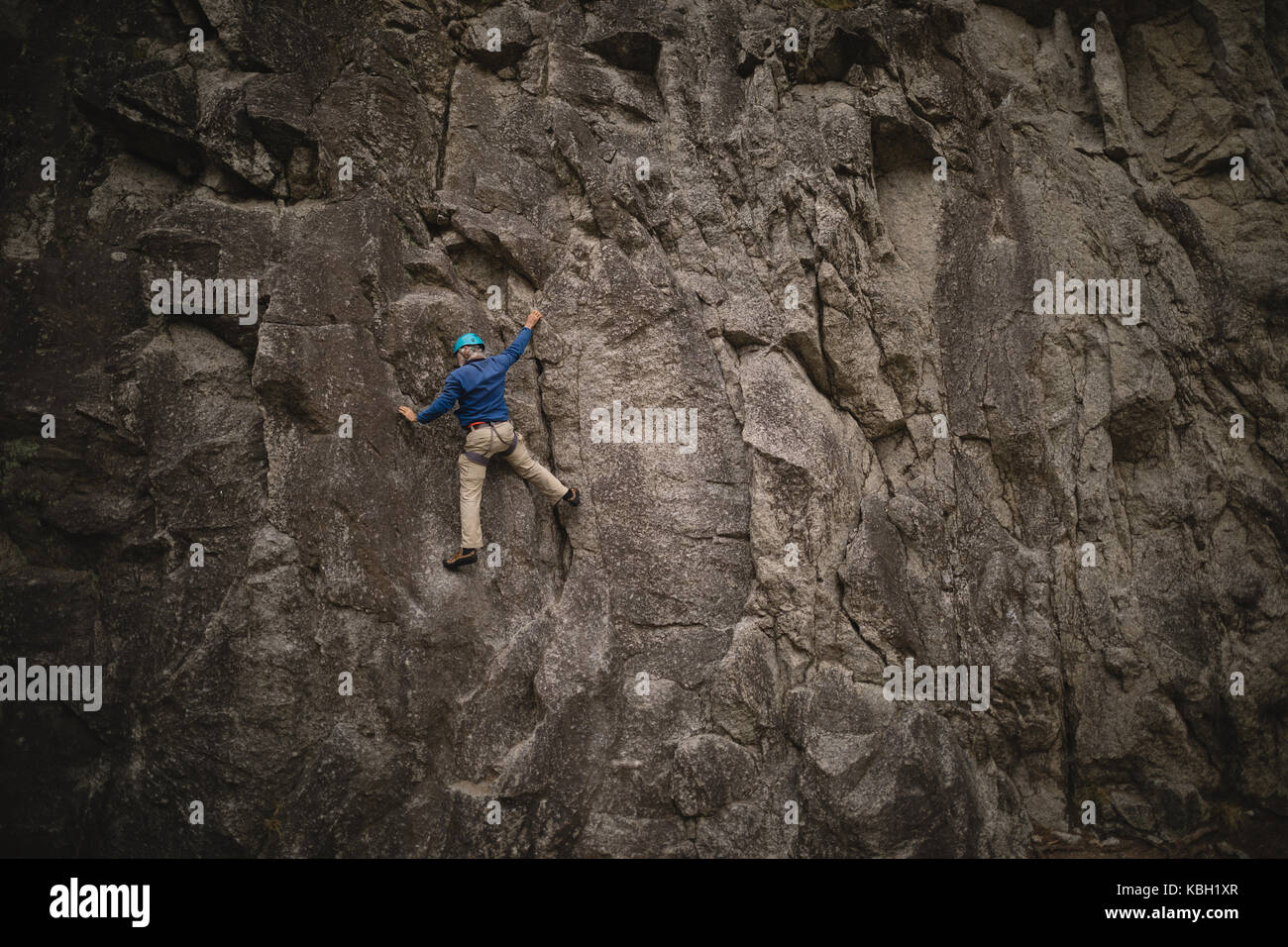Man climbing cliff hi-res stock photography and images - Alamy