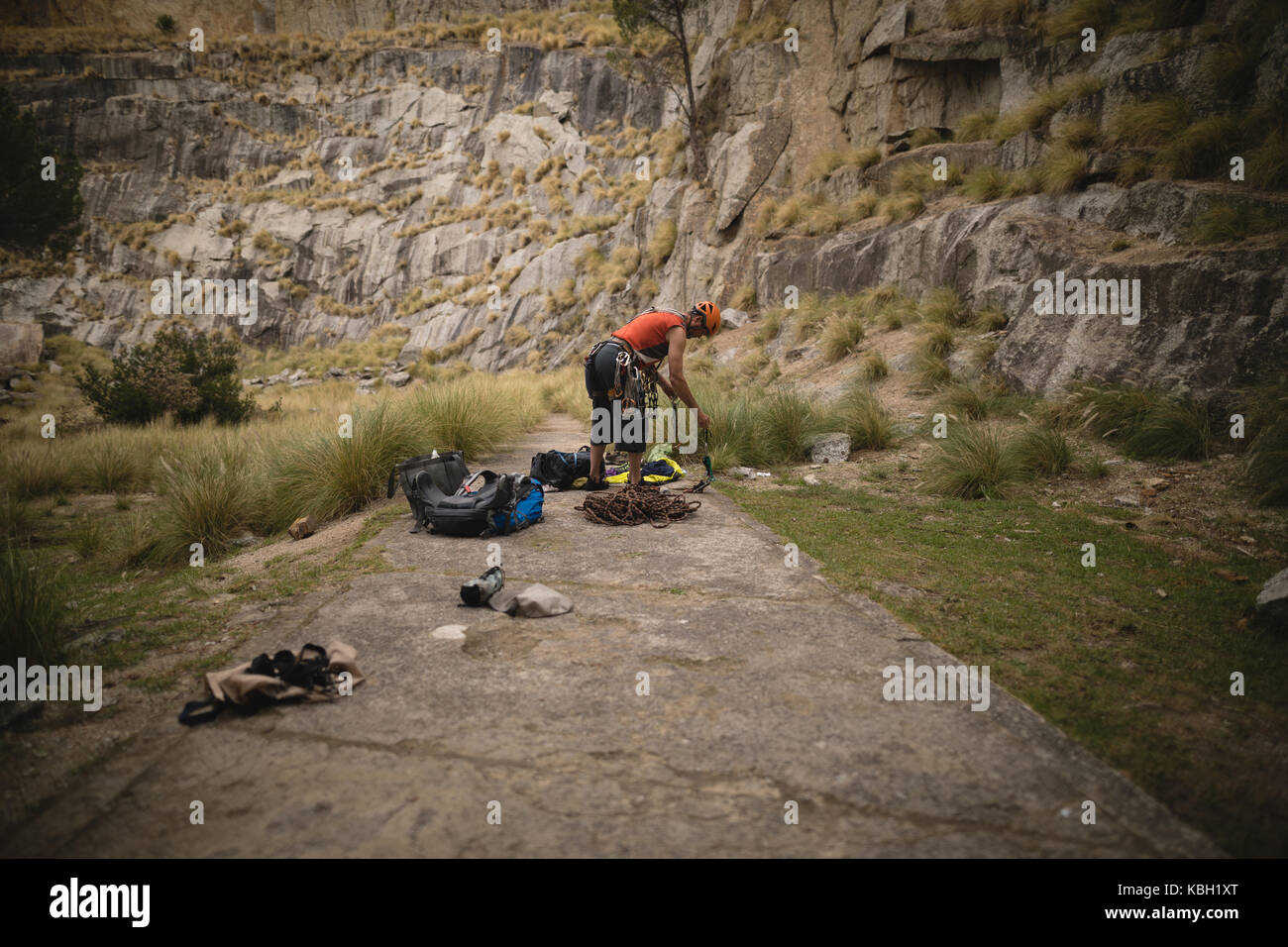 Mid-section of hiker arranging climbing rope Stock Photo - Alamy