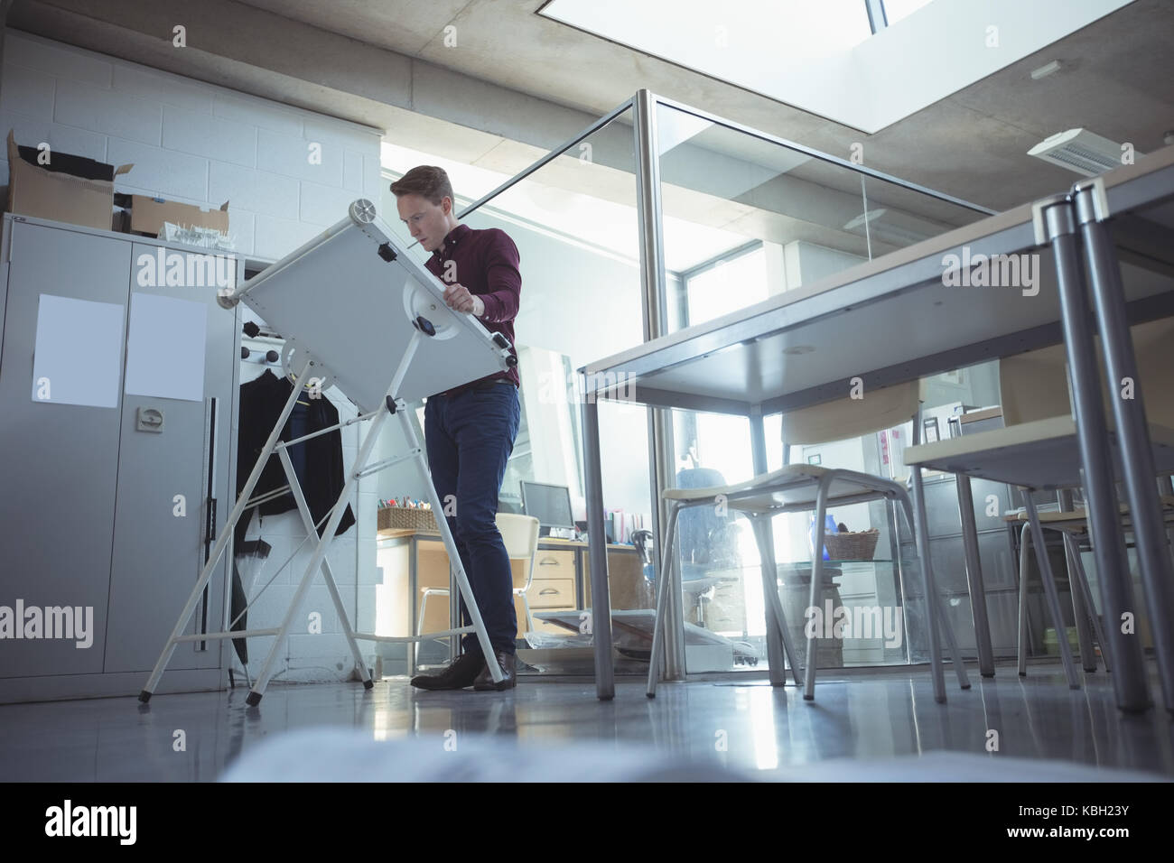 Architect working at drafting table in studio Stock Photo - Alamy