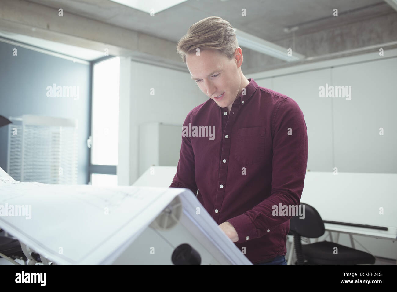 Architect working at drafting table in studio Stock Photo - Alamy