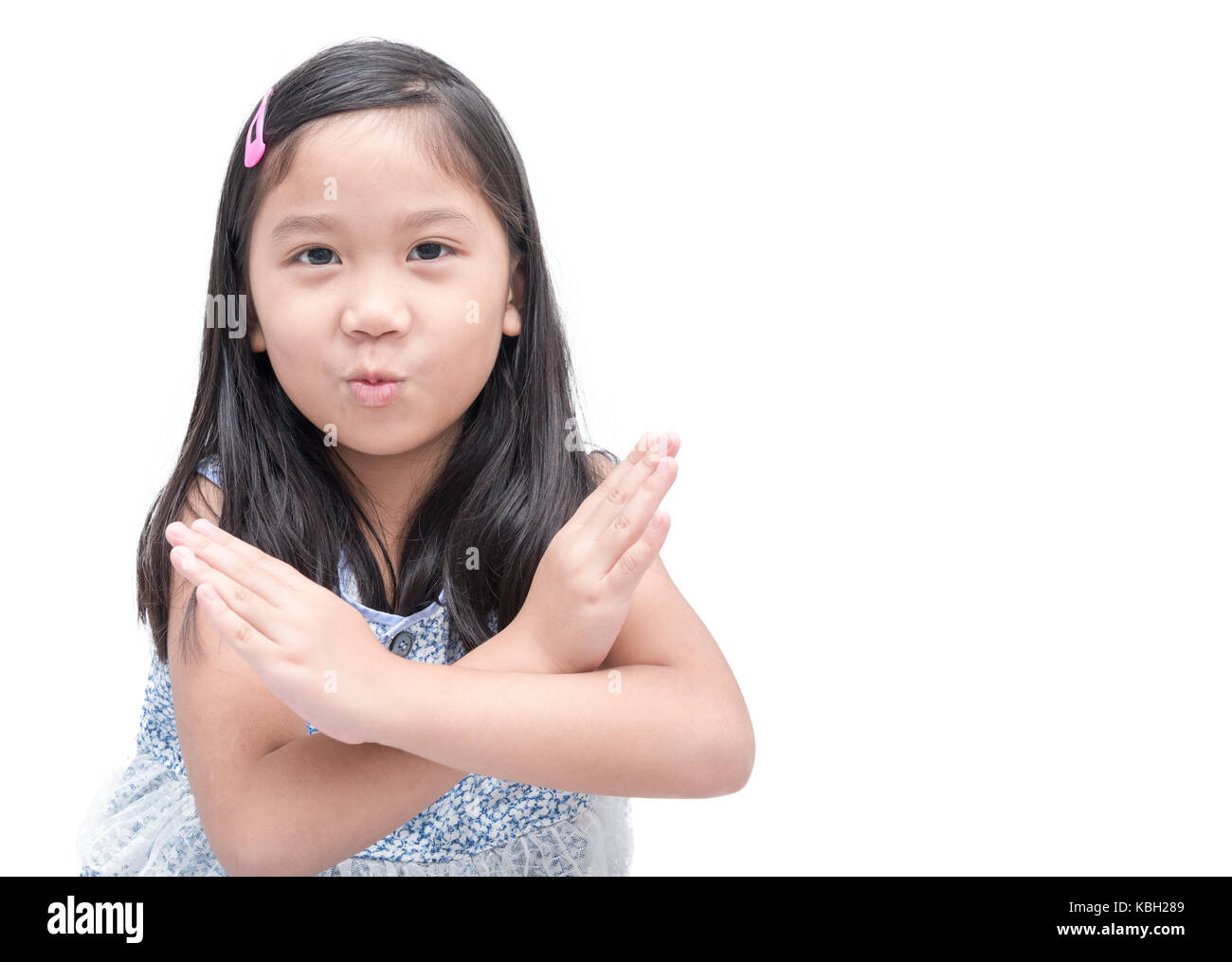 cute asian girl making stop gesture over white background, sign and ...