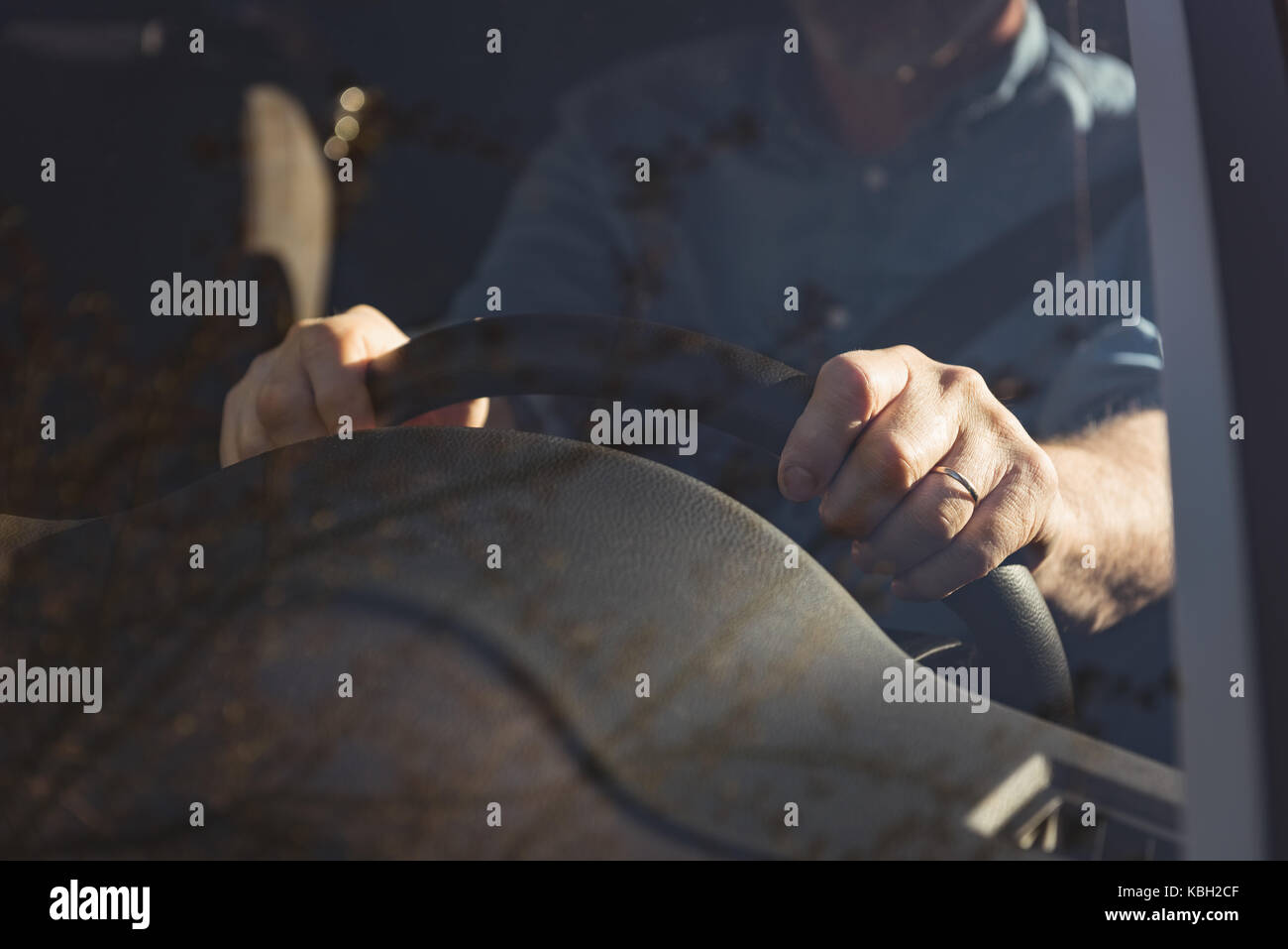 Close-up of man driving car Stock Photo - Alamy
