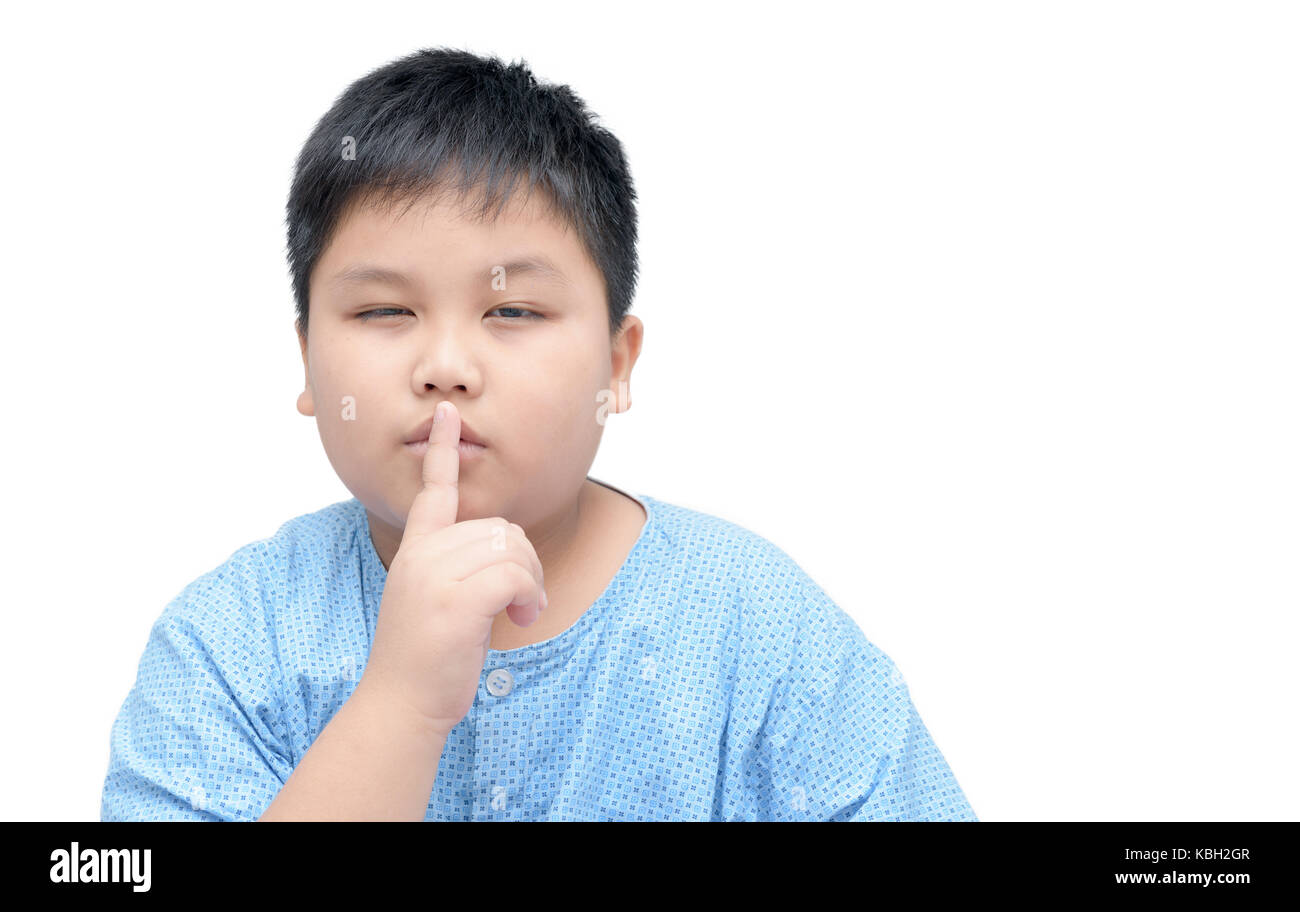 Portrait of obese fat boy with finger on lips isolated on white ...