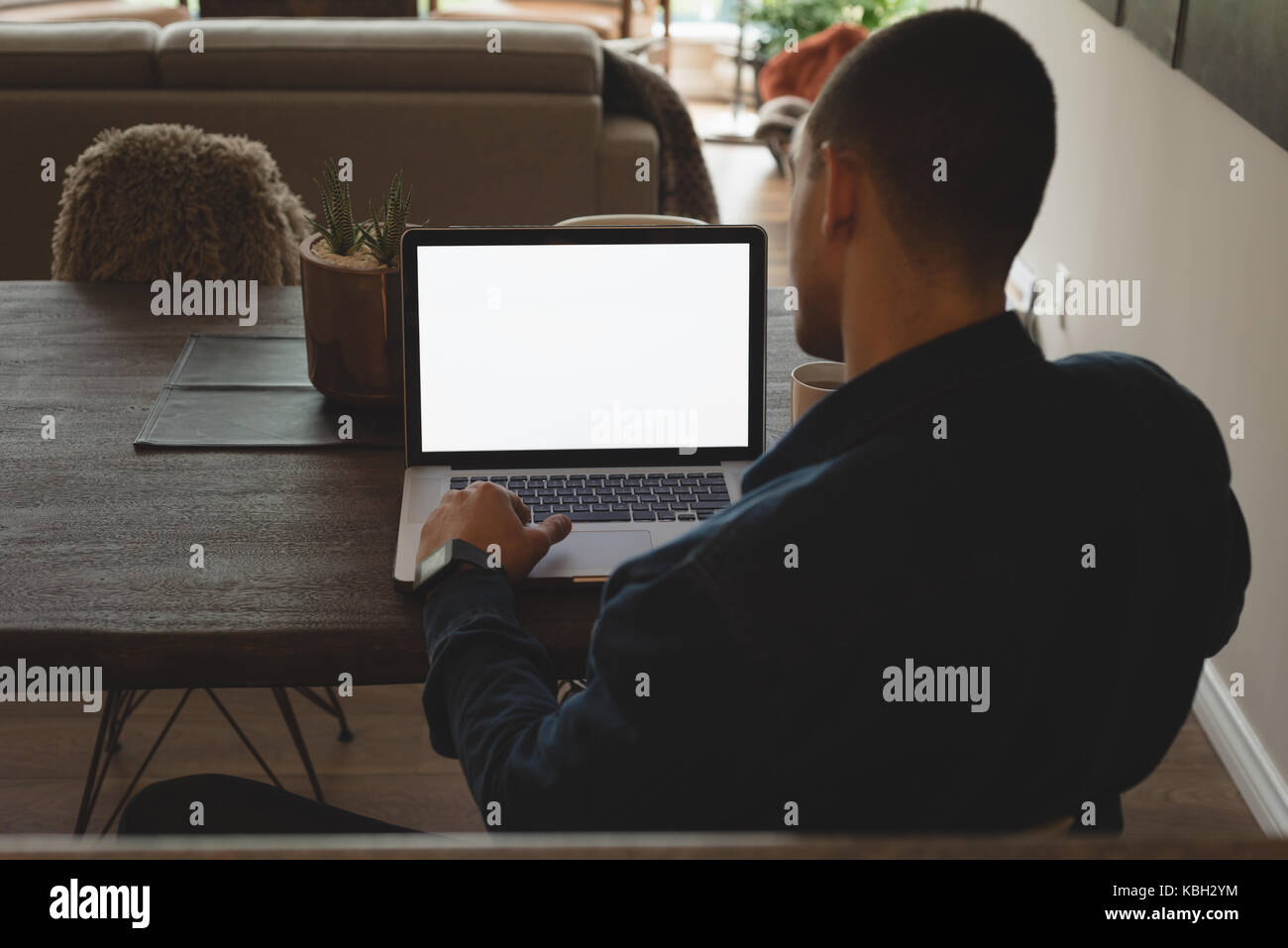 Man laptop rear view home hi-res stock photography and images - Alamy