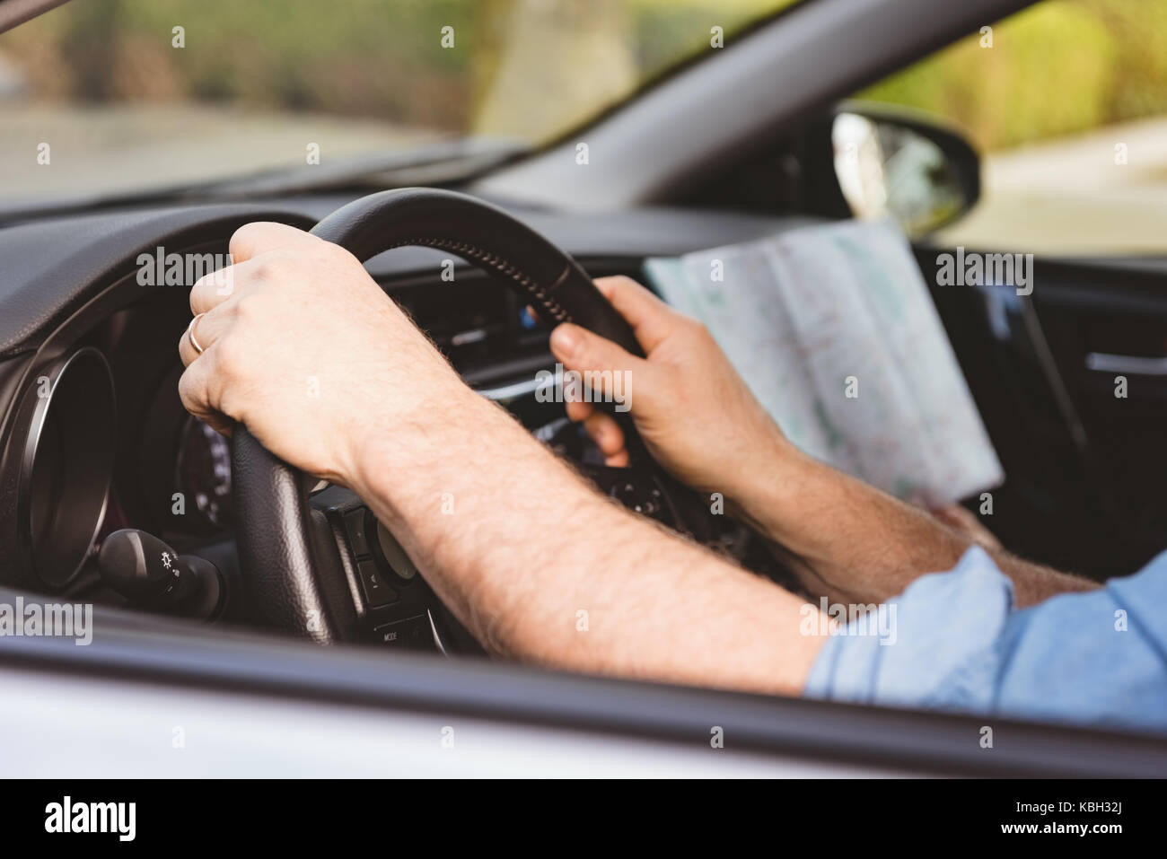 Close-up of man driving car Stock Photo - Alamy