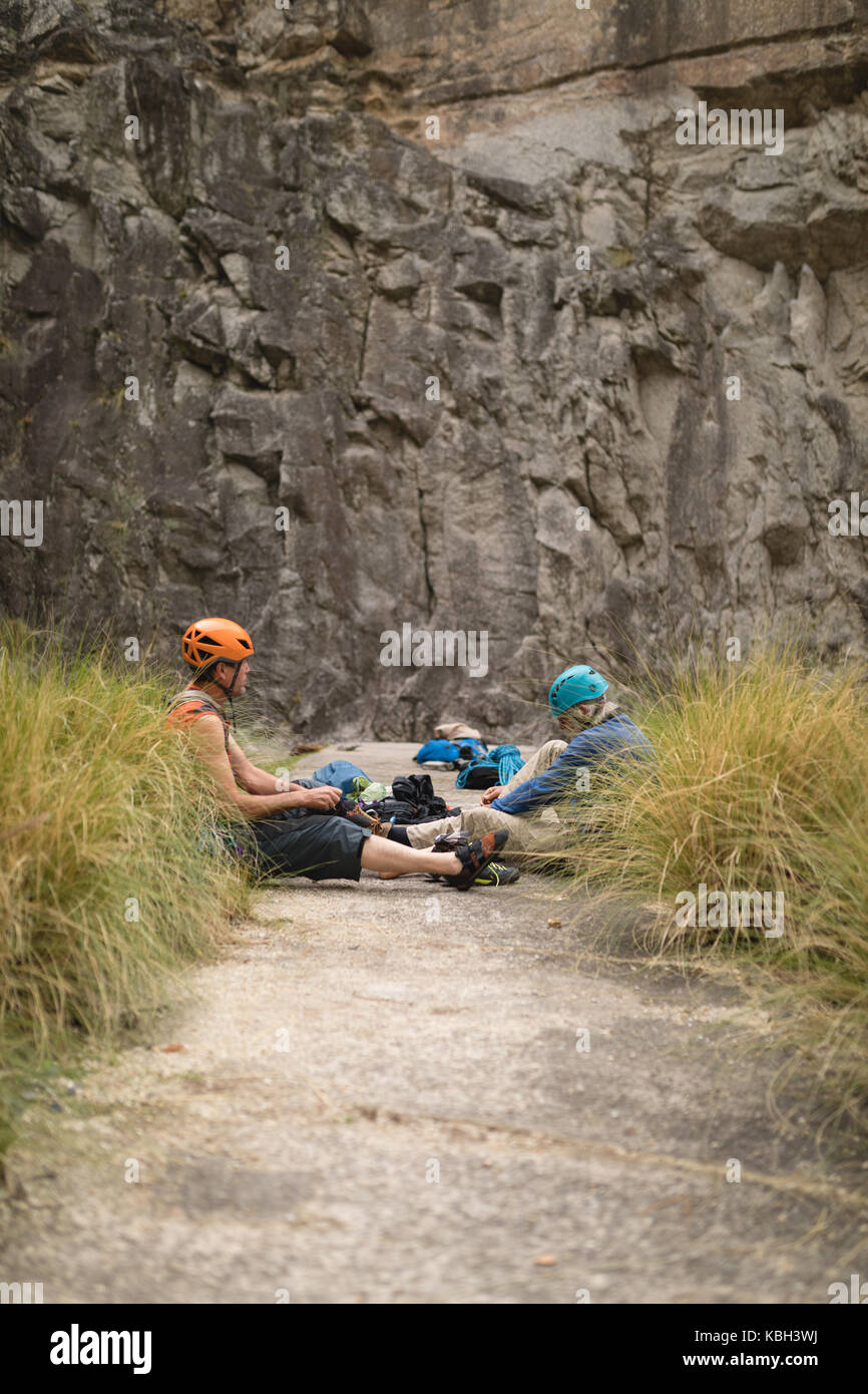 Tired hikers resting while hiking Stock Photo - Alamy