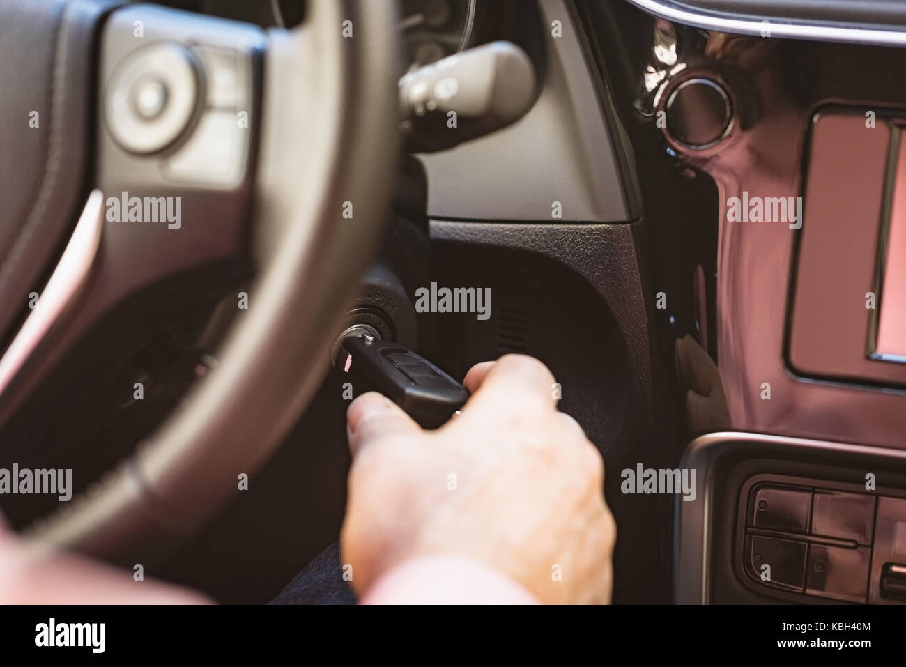 Close-up of man starting the car Stock Photo - Alamy