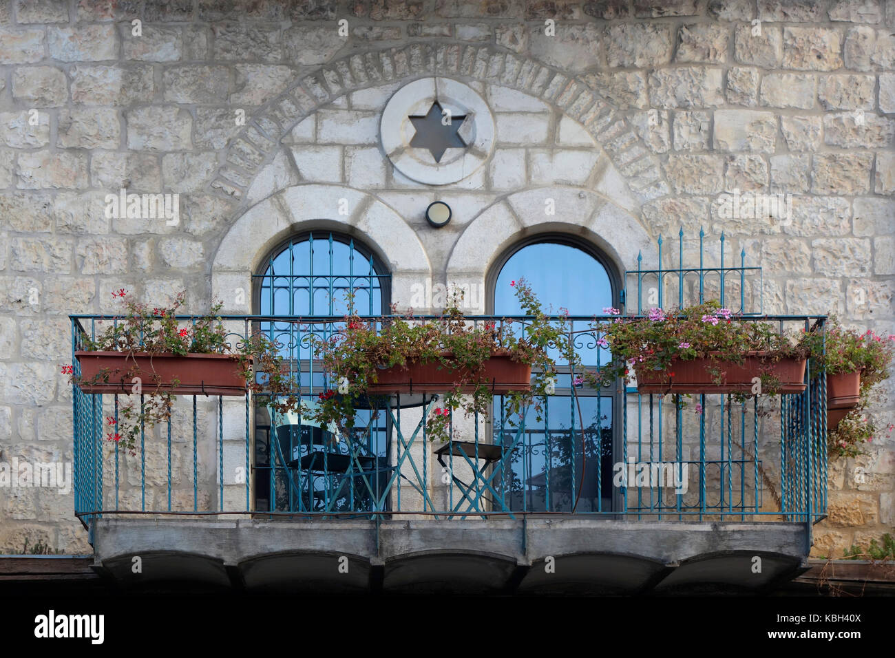 A ventilation window, in the shape of a Star of David, is above two ...