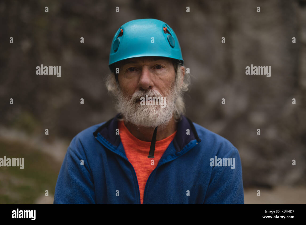 Portrait of senior man wearing protective helmet Stock Photo - Alamy