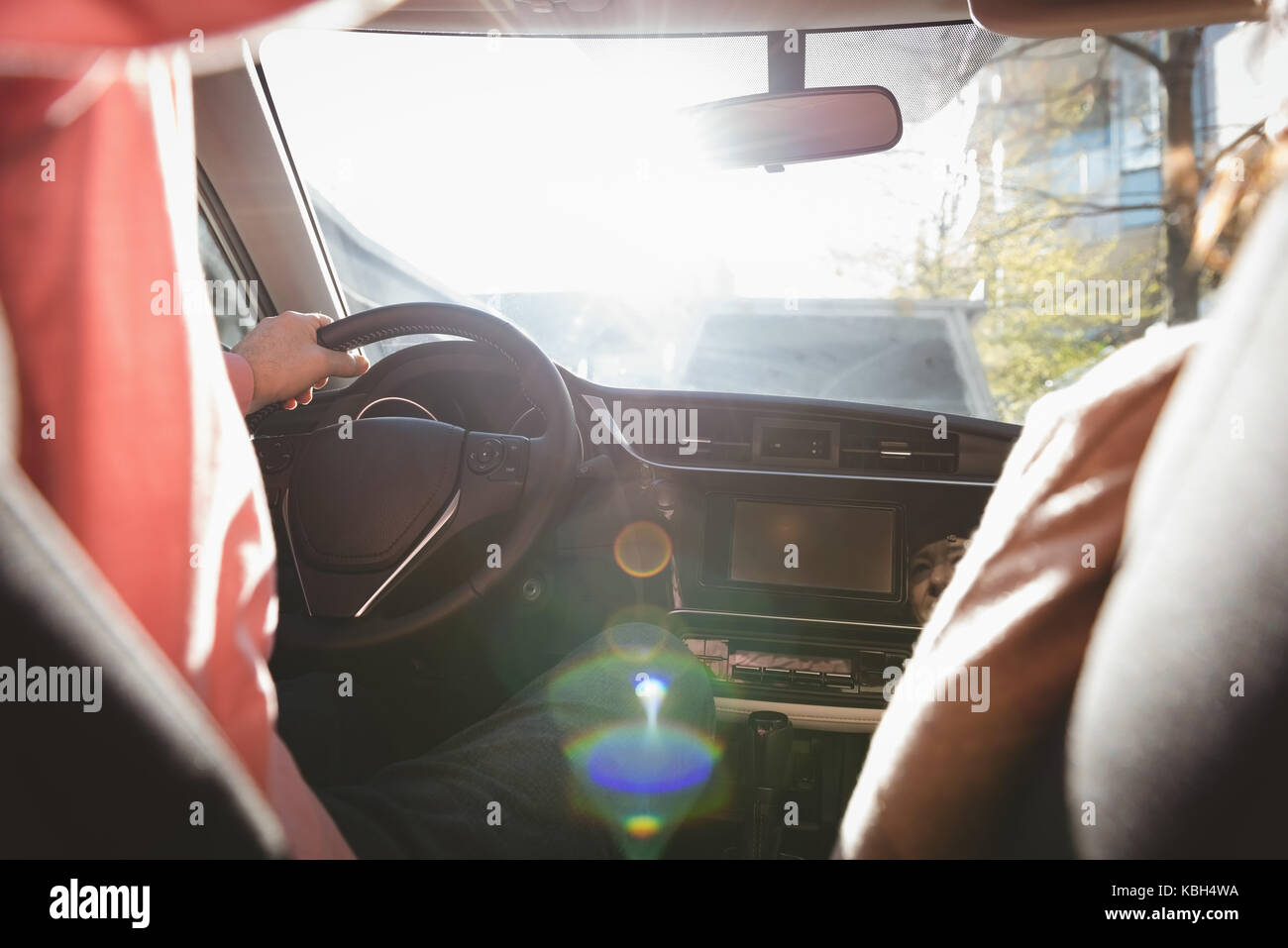 Couple interacting with each other while driving car Stock Photo - Alamy
