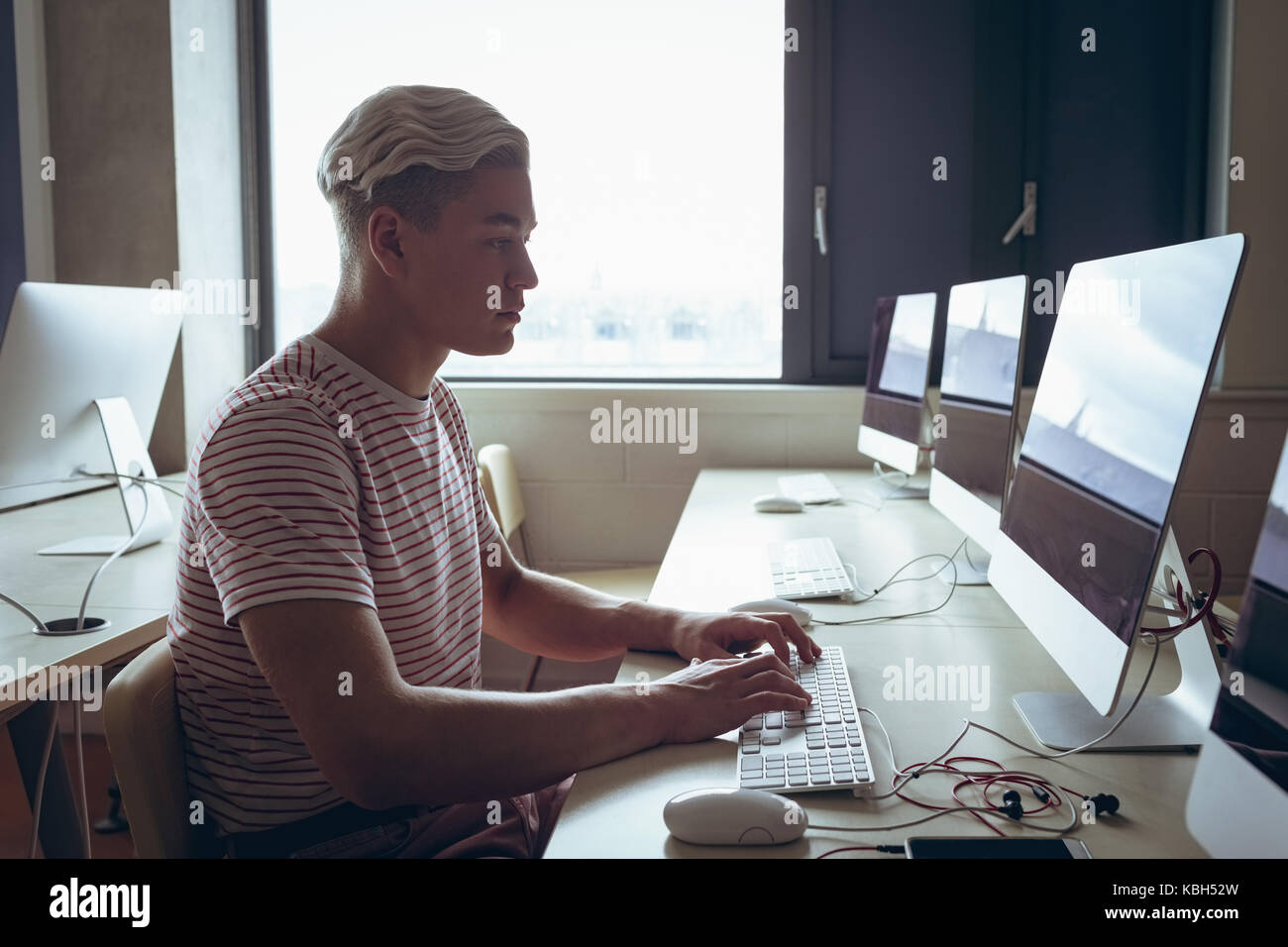 Man working on personal computer in office Stock Photo - Alamy