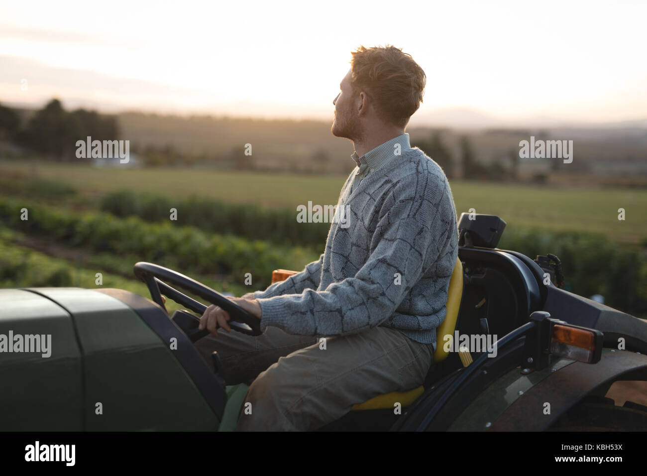 Farmer driving tractor hi-res stock photography and images - Alamy