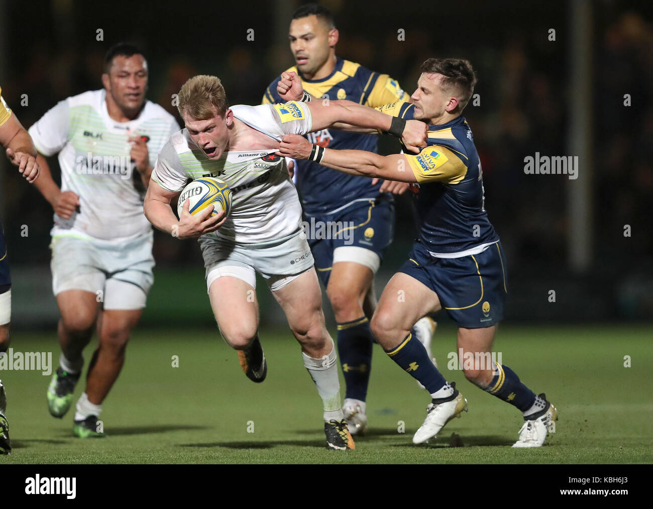 Saracens Nick Tompkins is tackled by Worcester Warriors Jono Kitto ...