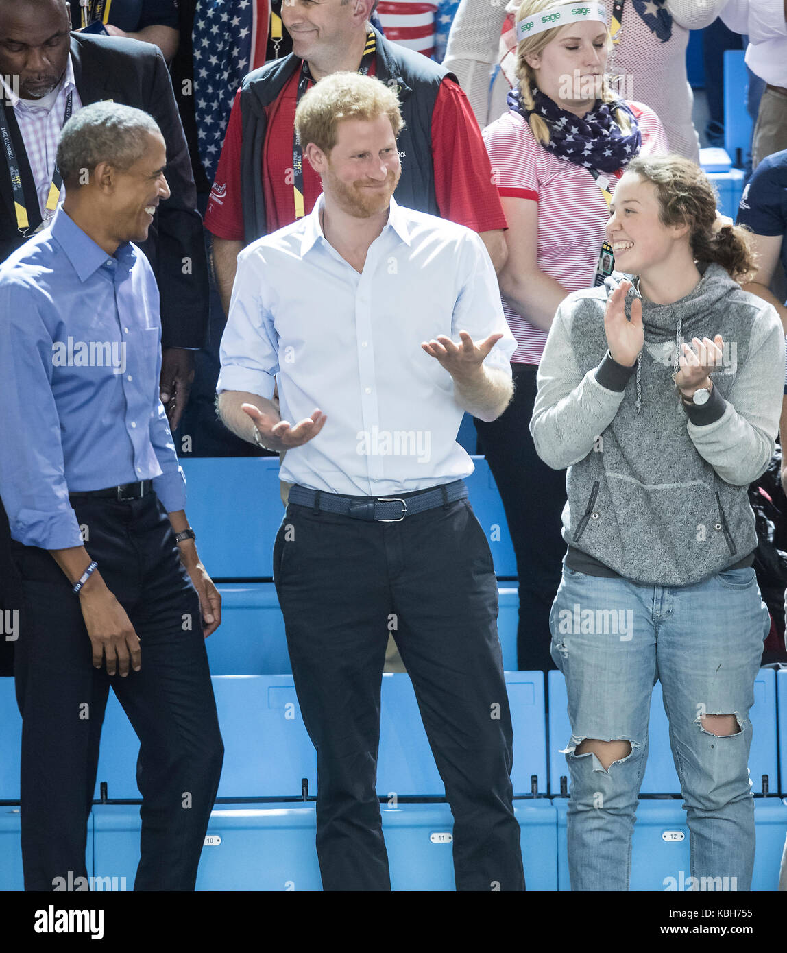 Barack Obama and Prince Harry are pictured with a spectator Hayley ...